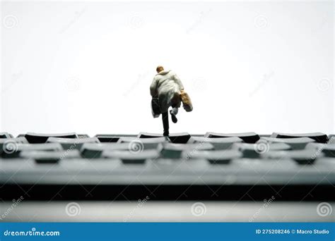 a businessman shadow silhouette running above keycaps keyboard carrying