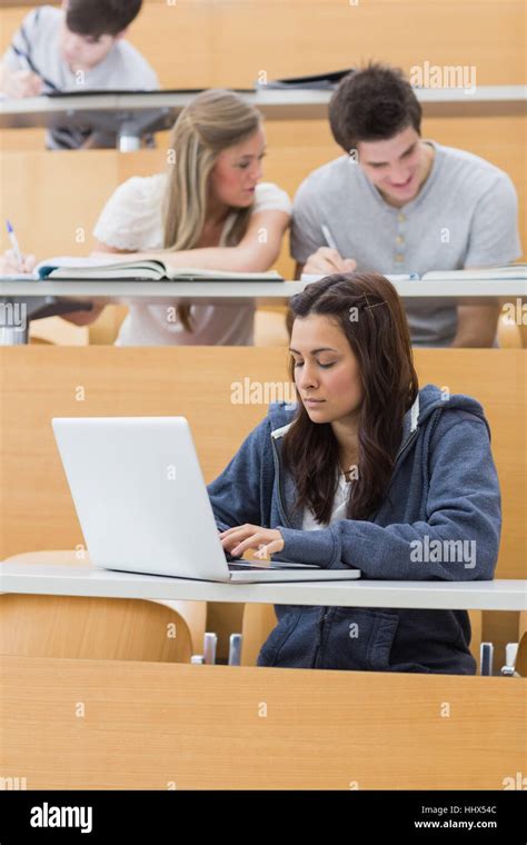 Babe Using Laptop To Take Notes In Lecture Hall Stock Photo Alamy