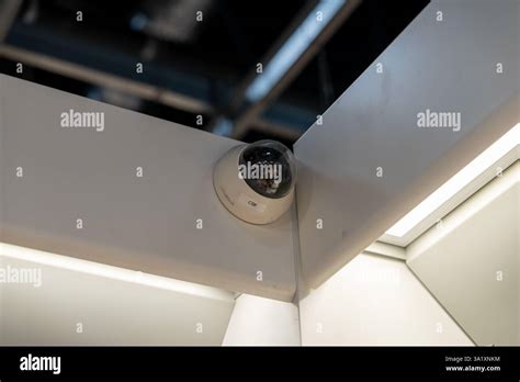 Security Camera Mounted In A Modern Interior Space Capturing An Security Camera Mounted In A Modern Interior Space Capturing An