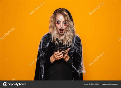 Attractive Wizard Woman Wearing Black Costume Halloween Makeup Holding