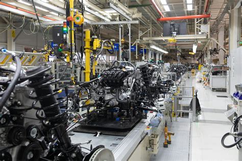 Assembly Line Production Of New Car Automated Welding Of Car Body On