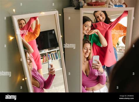 People Taking Selfie In Mirror