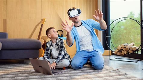 Happy Young Father And Son Testing Vr Goggles Playing Augmented Video