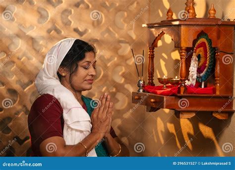 Devotional Indian Woman Praying To God During Early Morning Sunrise