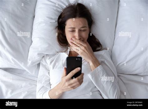 Frustrated Young Brunette Woman Crying Reading Message With Bad News