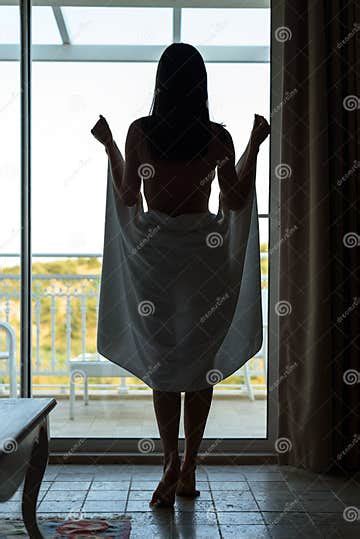 Silhouette Of A Half Naked Woman With A Towel In Front Of The Panoramic