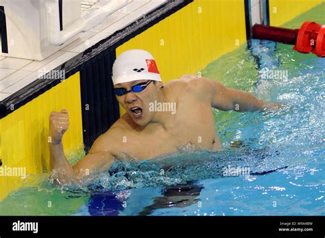 Chinas Xie Zhi Celebrates In The Water After Winning The Mens 50m Breaststroke Final At The 16th