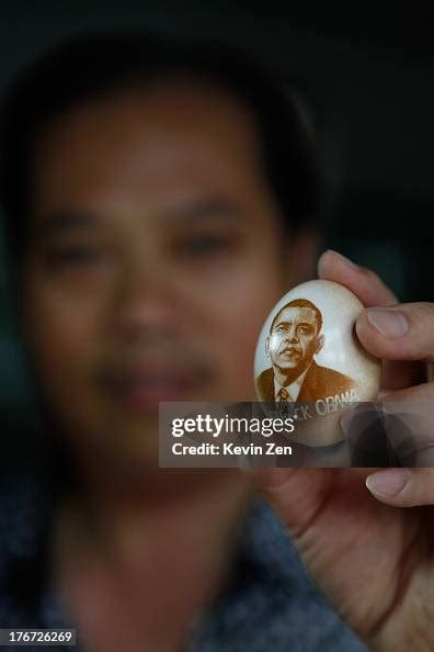 Pu Derong Shows His Work On Eggshell On Which He Carved A Portrait
