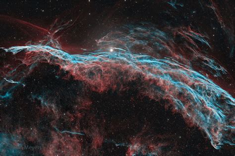 A Starfield Is Shown That Has A Multi Filamentnebula Flowing Across It
