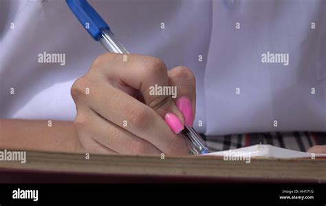 Female Writing In Notebook Stock Photo Alamy
