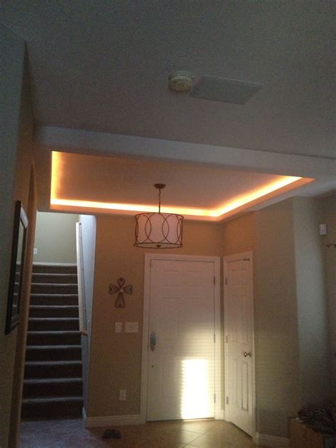Entry Cove Ceiling With Rope Lighting And Pendant Light