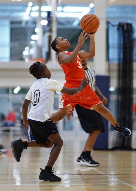 Black Young Boy Holding And Ready To Pass The Ball Editorial