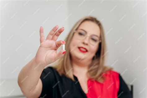 Premium Photo Smiling Proctologist Doctor Showing Rectal Suppository