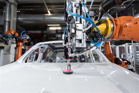 automated surface processing at bmw group plant regensburg trio of