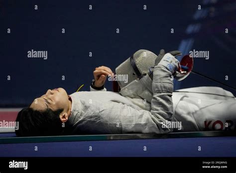 Koreas Kim Junho Reacts After Injuring During The Mens Team Sabre