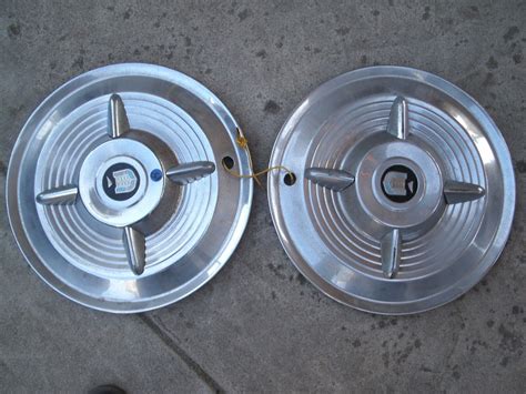 4 Used 1956 Mercury Hubcaps With New Accessory Spinners Ebay