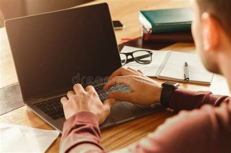 Unrecognizable Man Working On Laptop Sitting In Office Cropped Stock