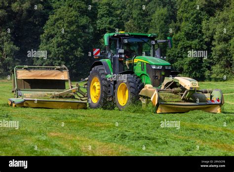 Grass Mowing In A Small Field Near Waldheim With A John Deere Tractor