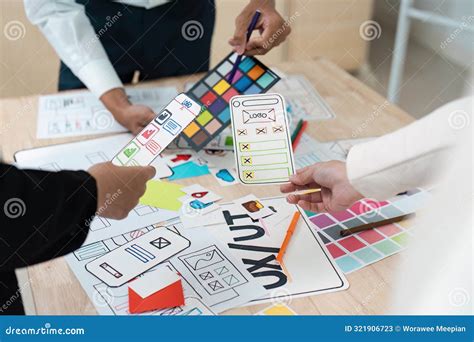 Creative Team Collaboration On Ux Ui Design Concepts With Wireframes And Color Palettes For