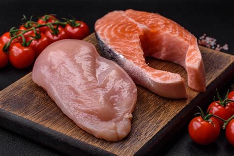 Premium Photo Chicken Or Turkey Fillet And Salmon Steak With Spices