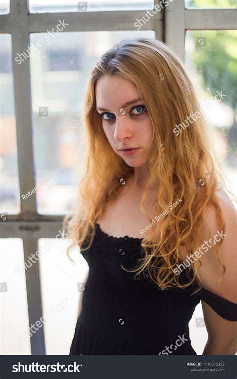 Photo Very Attractive Redhead Wearing Black Stock Photo Edit Now