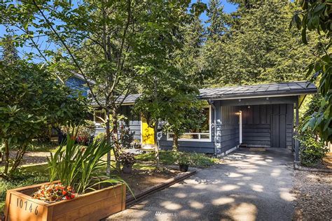 Gray House Surrounded By Trees Seattle Wa
