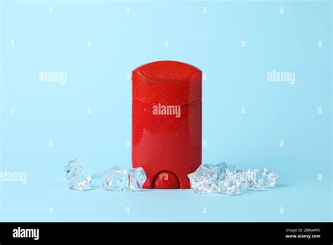 Body Deodorant And Ice On Blue Background Blank Space For Text Stock