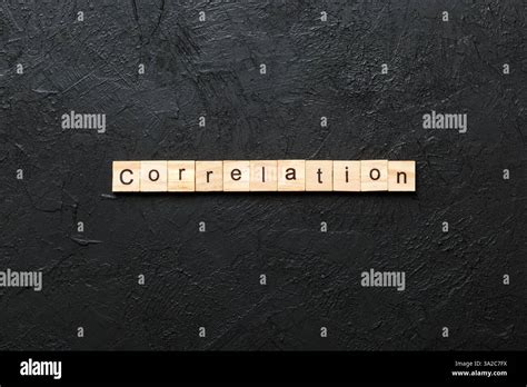 Correlation Word Written On Wood Block Correlation Text On Table