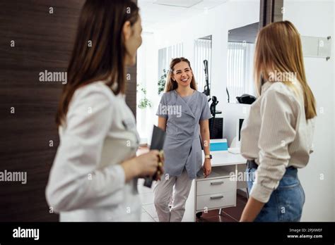 Joyful Female Beautician Meets Her New Client Three Women Communicate