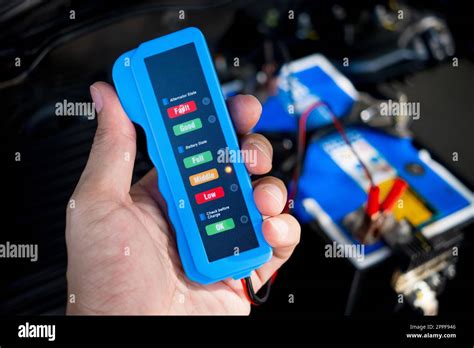 Checking A Car Battery Level With Car Battery Checker Car Repairing