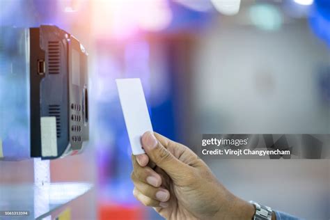 Businessman Hand Inserting Key Card To Door Access Control Keypad With Key Card Reader Security