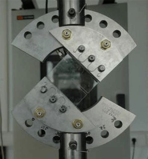 mixed mode loading device with clamped sent specimen f ¼ 45