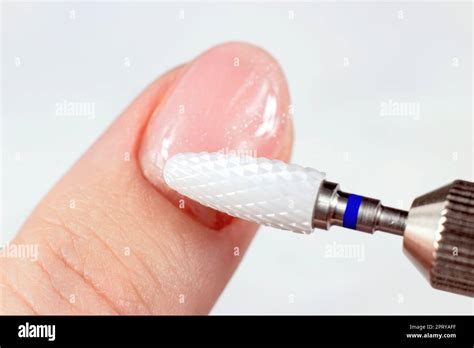 Woman Hands Making Self Manicure Removing Pink Gel Nail Polish At Home
