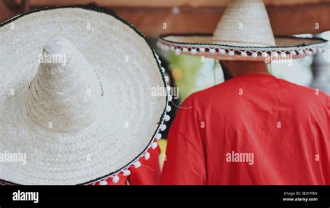 People Wearing Traditional Sombreros Celebrating Mexican Culture At A
