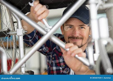 Man Assembling Wheelchair In Workshop Stock Photo Image Of Wheelchair Crossbar 285687020