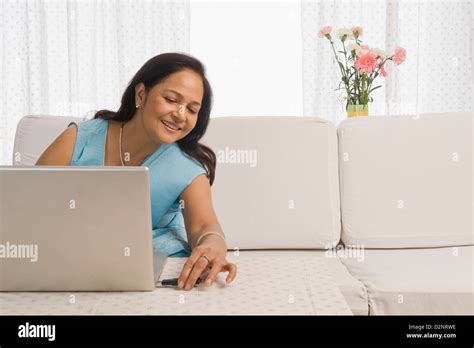 Woman Connecting A USB Device To A Laptop Stock Photo Alamy