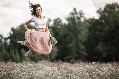Girl Jumping Field 4k Wallpaper Hd Girls Wallpapers 4k Wallpapers