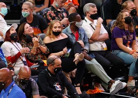 Rarely Appears In Public Adele In Striking Coat Cheers At A Basketball Game
