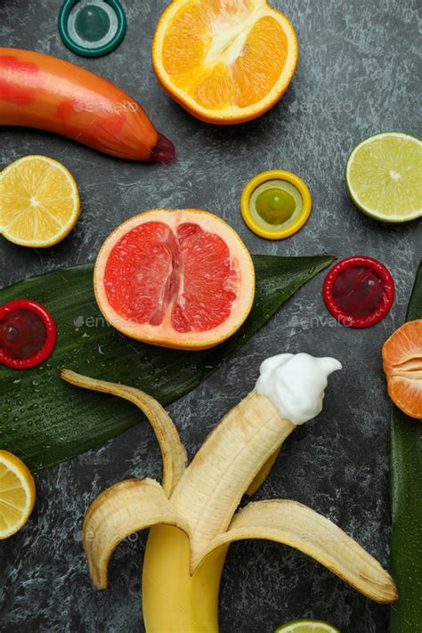Sex Concept With Fruits And Condoms On Dark Background Stock Photo By AtlasComposer