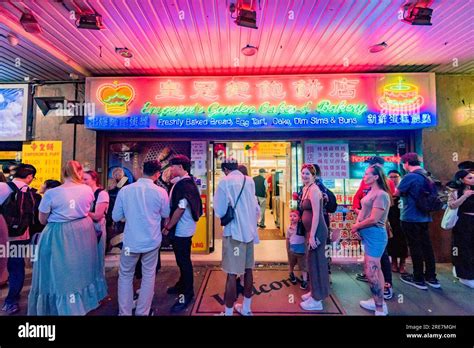Australian People Queue For Takeaway Dumplings At Night Time During