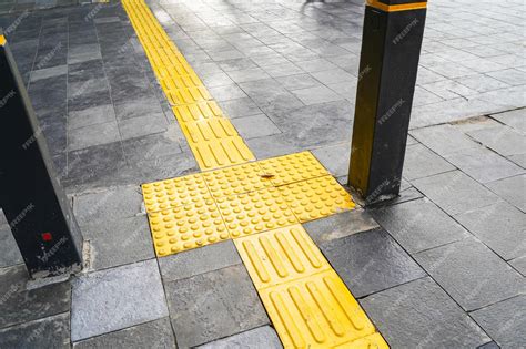 Premium Photo Pedestrian Paths Braille Block In Tactile Paving For The Blind Handicapped In