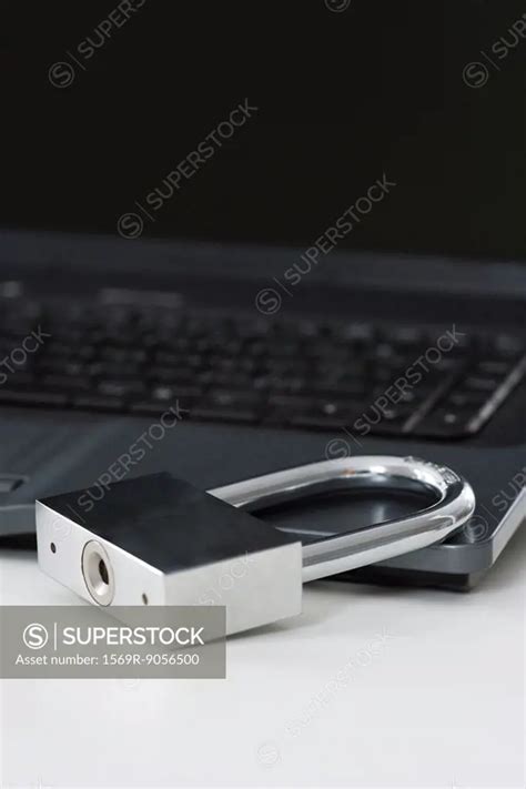 padlock on laptop computer superstock