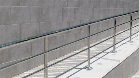 a ramp with stainless steel handrails for wheelchairs bicycles and