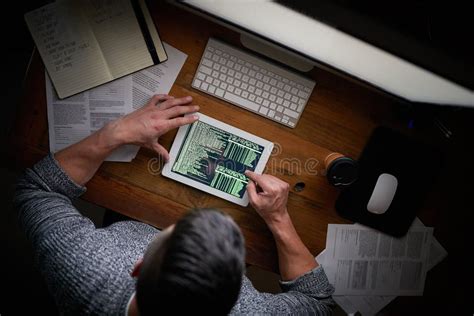 Coding Through The Night High Angle Shot Of An Unidentifiable Computer