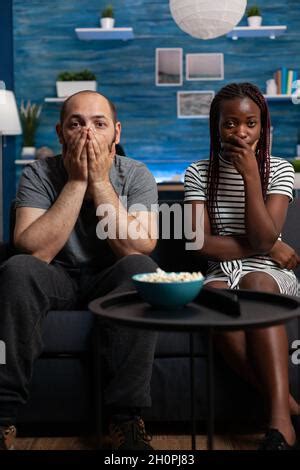 Pov Of Interracial Couple Watching Movie On Tv With Snack At Home
