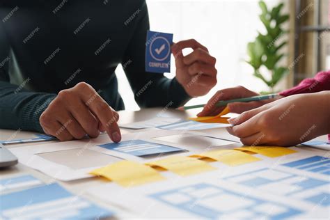 Premium Photo Group Of Ux Developer And Ui Designer Brainstorming About App Interface Design