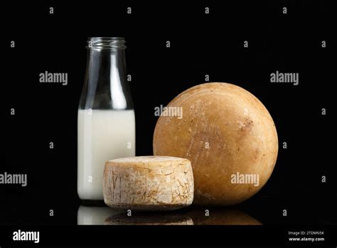 Artisanal And Natural Whole Cheese Placed On A Wooden Board And