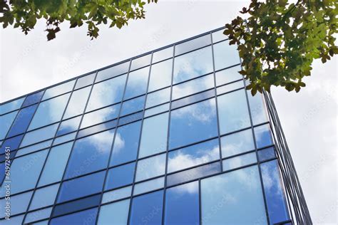 Construction Of A Glass Facade Structure Modern Office Building Glass And Clouds Real Estate