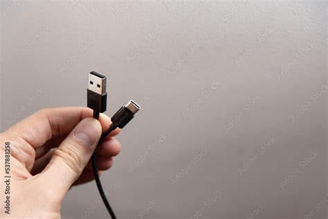 Different Types Of Usb Ports On A White Background In A Hand Stock Photo Adobe Stock