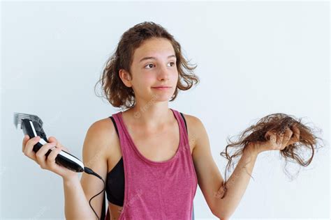 Premium Photo Girl Shaves Long Hair Baldly With Shaving Machine